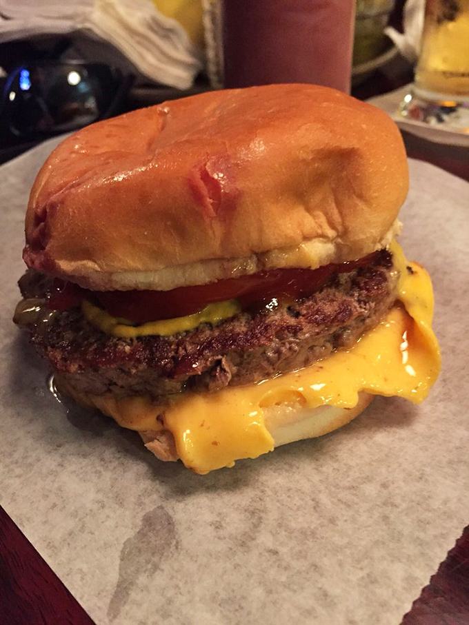 Behold burger nirvana &ndash; a perfectly seared patty with molten cheese cascading down the sides, served on wax paper instead of china. Who needs plates anyway?