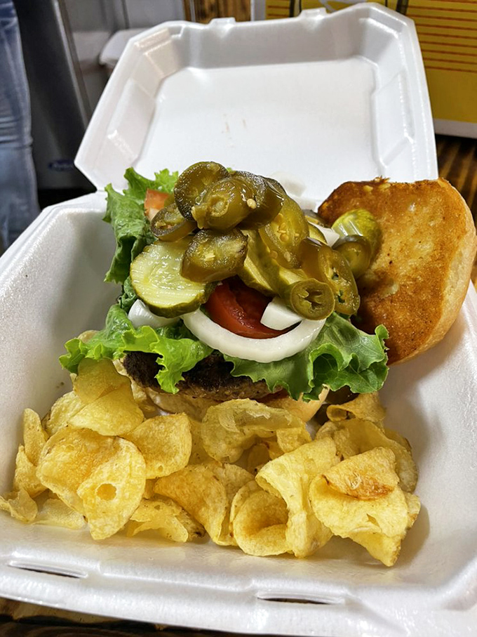 This isn't just a burger&mdash;it's edible architecture with layers of fresh lettuce, tomato, onion, and enough jalape&ntilde;os to remind you you're in Texas.