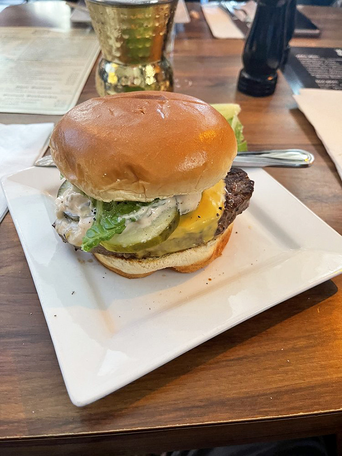 Behold the hero of our story: a perfectly stacked burger that doesn't need Instagram filters to look this good. Those fresh toppings aren't just for show.