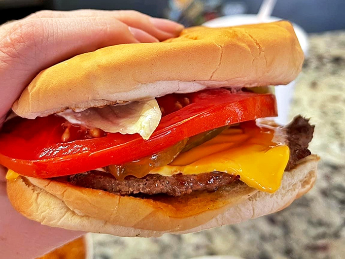 This isn't just a cheeseburger&mdash;it's edible architecture where each layer plays its part in a symphony of flavors that's been bringing smiles since Eisenhower.