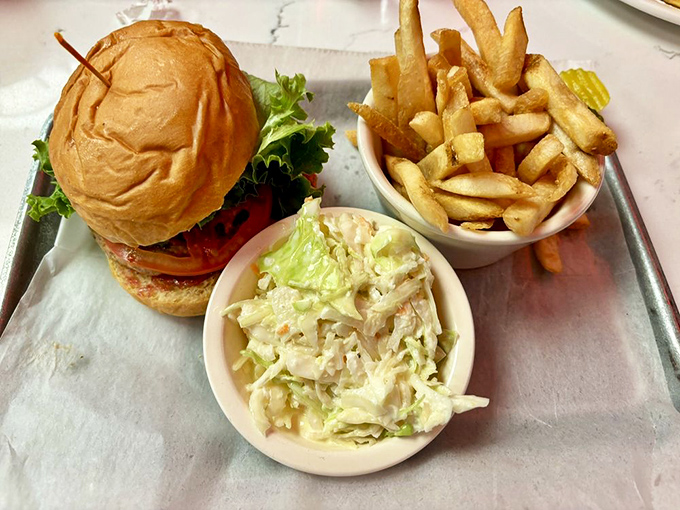 This isn't just a burger – it's architecture with flavor, accompanied by fries that deserve their own fan club.