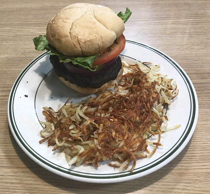 Behold the Black Bean Burger with impossibly golden hash browns that could convert even the most devoted carnivores temporarily.