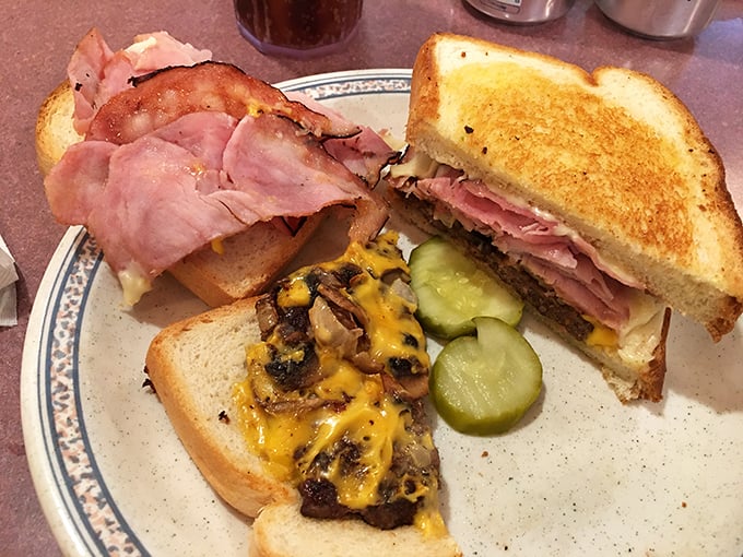 Behold the burger masterpiece: perfectly melted cheese cascading over what dreams are made of.