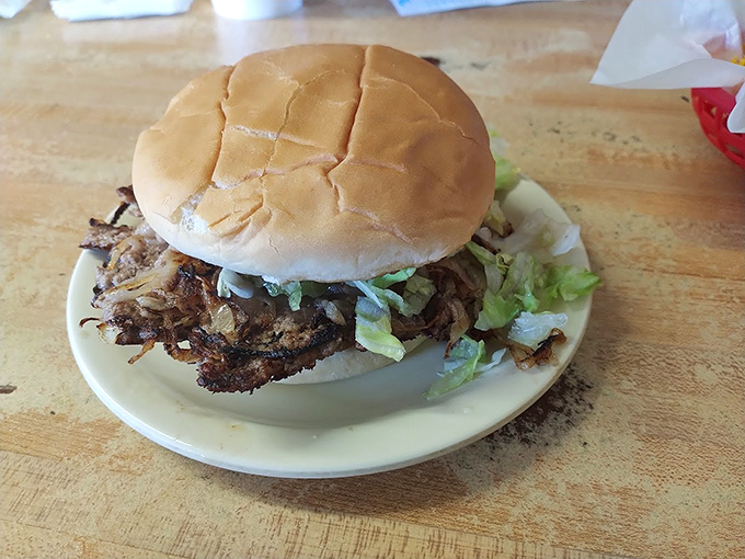 The Oklahoma onion burger in its natural habitat&mdash;a perfect symphony of beef, caramelized onions, and fresh toppings that makes fast food chains weep with inadequacy.
