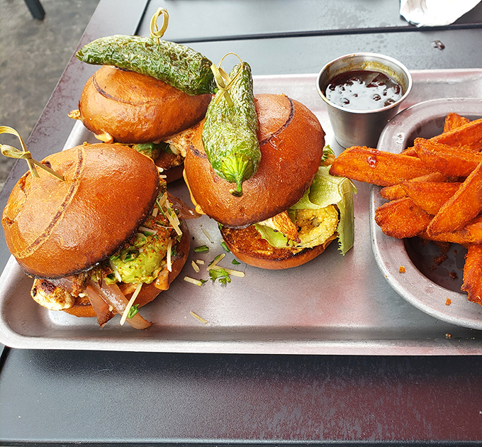 These aren't just burgers&mdash;they're edible architecture. Notice how the pickle stands proudly like a flag claiming delicious territory.