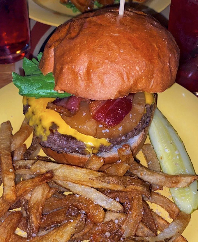 Architecture of deliciousness: a perfectly seared patty, melty cheese, and that bun &ndash; toasted just enough to handle the juicy masterpiece within.