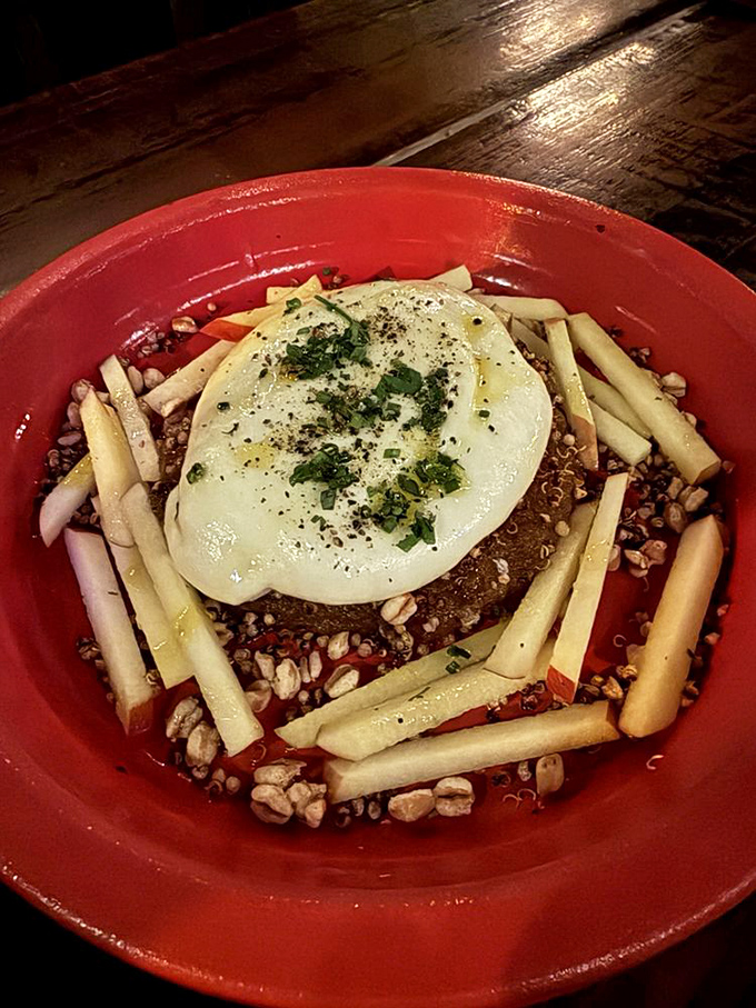 This burrata sits like edible silk, waiting to spill its creamy secrets all over your lucky plate.