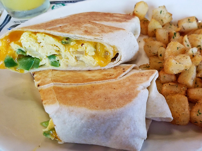 Breakfast burritos: proof that good things come in tortilla packages. This golden-hued beauty with home fries on the side makes portable perfection.