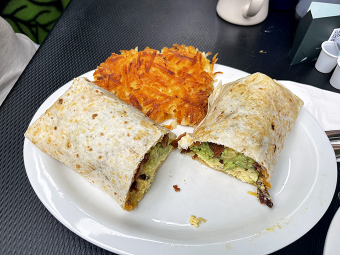 Behold the breakfast burrito in its natural habitat&mdash;golden-brown, stuffed with avocado and eggs, with a side of hash browns that could make a potato weep with pride.