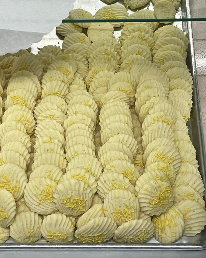 These butter cookies aren't just treats; they're edible works of art with their perfectly ridged edges and sunny yellow centers.