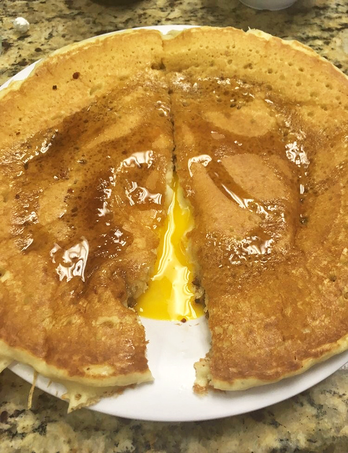 The "All In One" pancake reveals its molten egg center like breakfast's answer to a chocolate lava cake. Pure morning magic.