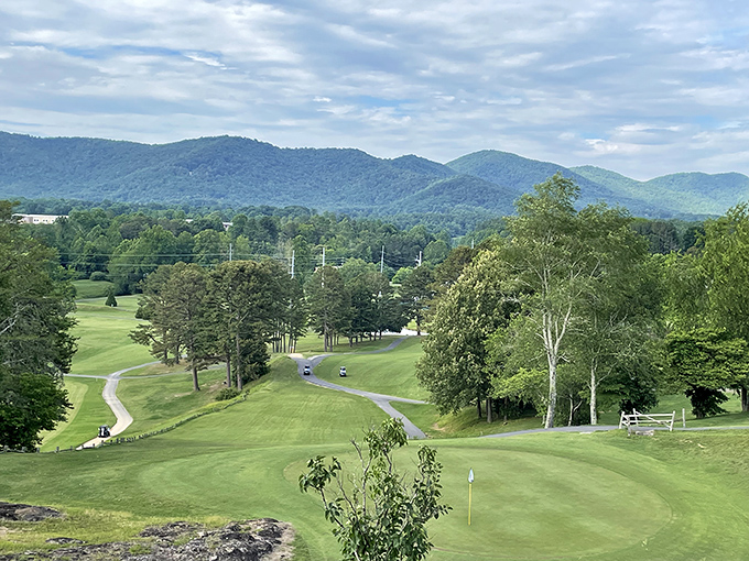 Golf carts trace ribbons across emerald fairways while the Blue Ridge Mountains stand guard. Who needs a country club membership when paradise costs so much less?