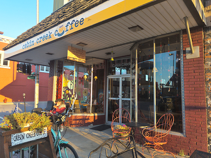 Cabin Creek Coffee, where vintage charm meets caffeinated bliss. The turquoise bicycle out front practically whispers, "Stay awhile, the emails can wait."