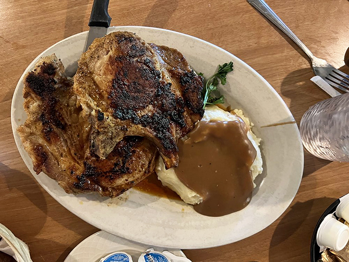 These Cajun pork chops don't just whisper spice&mdash;they sing it, accompanied by a pool of gravy that demands to be sopped up with every last bite.