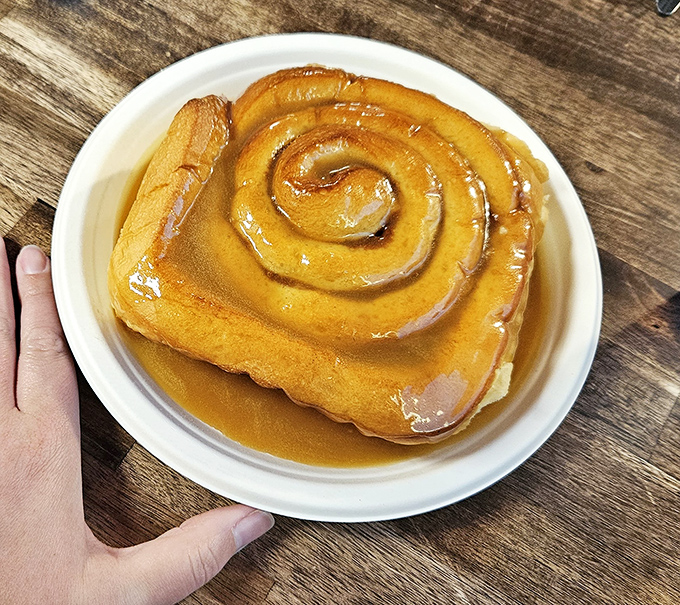 This caramel roll isn't just a pastry, it's a monument to breakfast indulgence &ndash; bigger than your fist and twice as satisfying.