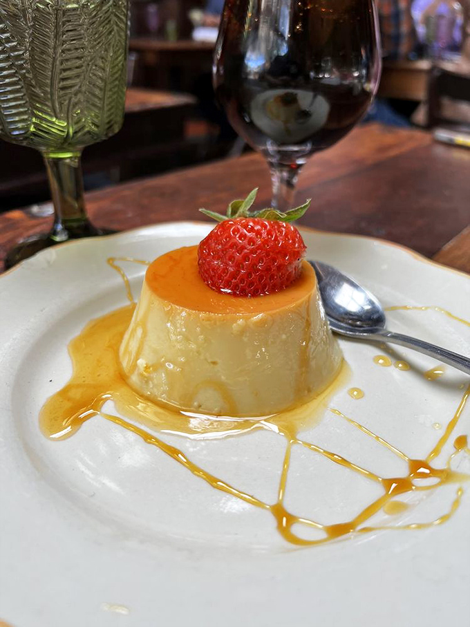 Here it is, folks&mdash;the flan that launched a thousand return visits, crowned with a strawberry like culinary royalty.