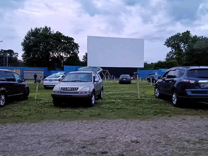SUVs and sedans gather like modern-day covered wagons, circled around their communal campfire&mdash;a story projected 40 feet high.