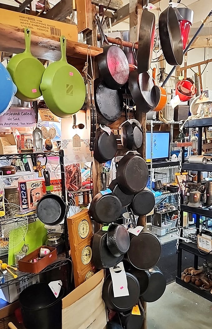 Cast iron heaven! These seasoned beauties hang like trophies of culinary battles past and future. Grandma would approve.