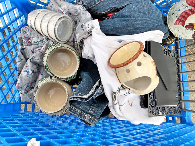 Treasure hunter's jackpot! Vintage ceramics nestled among denim and quirky decor &ndash; the thrill isn't just finding them, but imagining their stories.