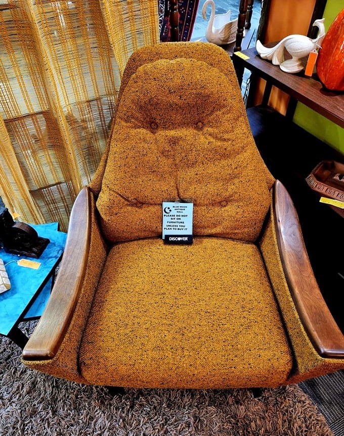 This mustard-colored mid-century chair isn't just furniture – it's a time machine waiting to transport you back to 1970s living rooms.