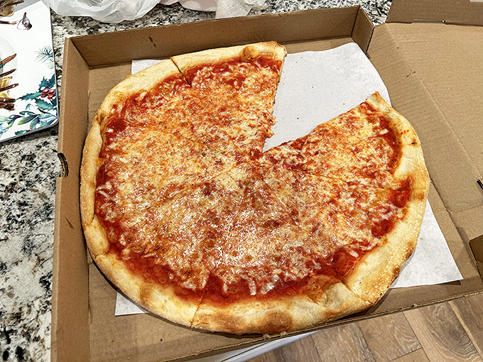 The holy grail of cheese pizza—simple, unpretentious, and absolutely perfect. This is what pizza dreams are made of, folks.