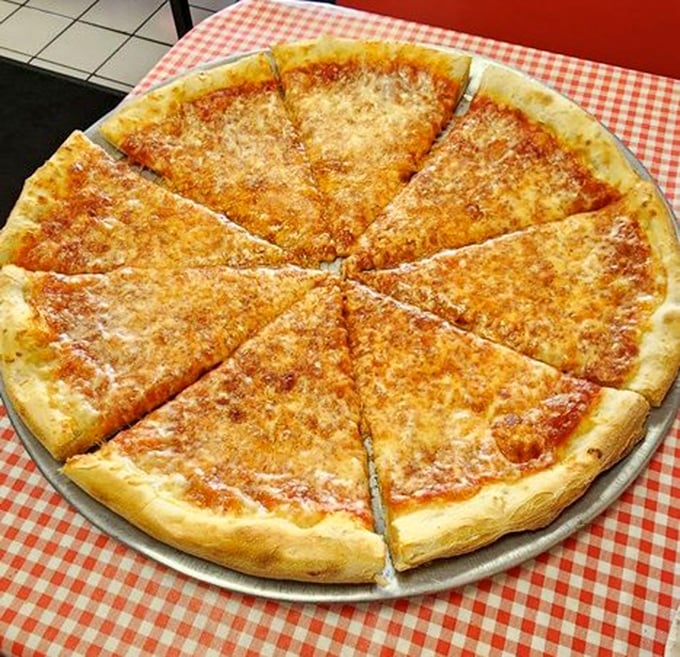 The star of the show in all its golden glory. This cheese pizza isn't just food; it's an argument against unnecessary complication. Perfection needs no embellishment.