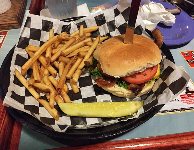 This isn't just a burger &ndash; it's architecture. The perfect stack of beef, cheese, and fresh veggies on a golden bun with crispy fries standing guard.