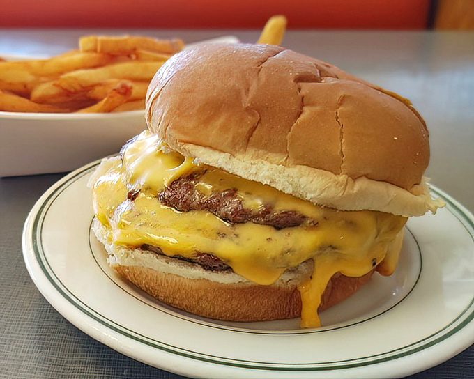Melted cheese cascading down a perfectly grilled patty&mdash;this isn't just a cheeseburger, it's edible poetry on a plate.