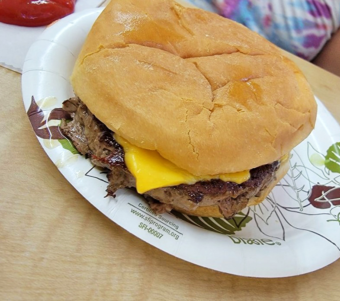 Behold the star of the show&mdash;a cheeseburger that refuses to be contained by its bun. This golden-seared patty doesn't need Instagram filters to look delicious.