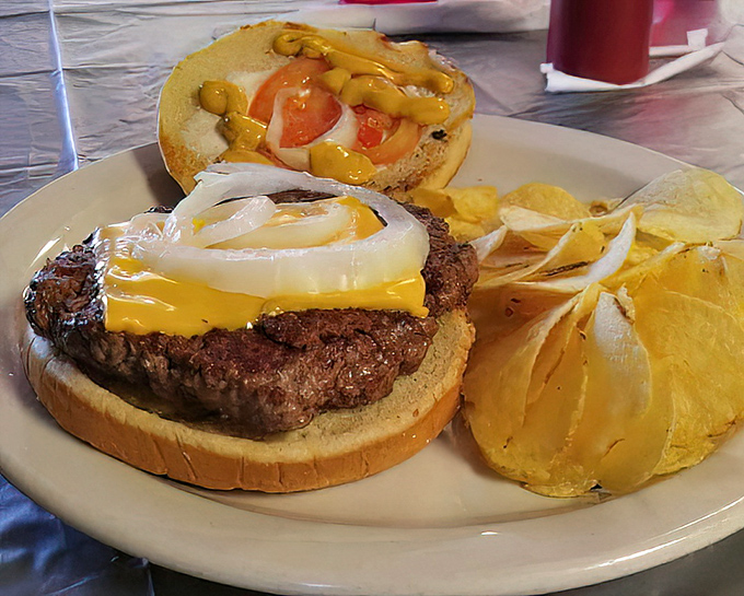 This isn't just a cheeseburger; it's edible poetry. The melted cheese cascading over a hand-formed patty tells you everything about this place's priorities.
