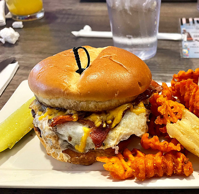 This isn't just a burger&mdash;it's edible architecture. Melted cheese cascades over bacon like delicious lava from Mount Appetite.