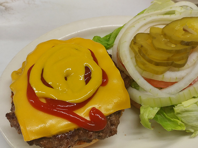 The cheeseburger arrives like a work of art for the everyman&mdash;melted American cheese cascading over a hand-formed patty with that perfect griddle char.