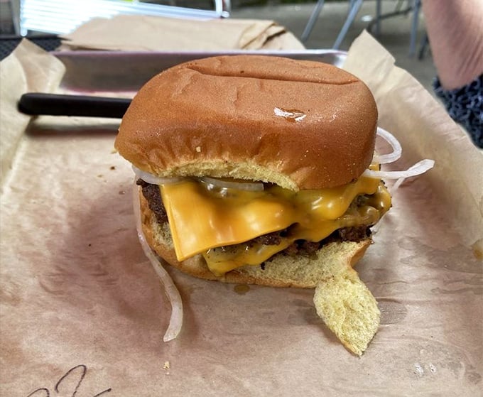 Behold the star of the show: melted American cheese cascading over a perfectly smashed patty. Poetry doesn't always need words.
