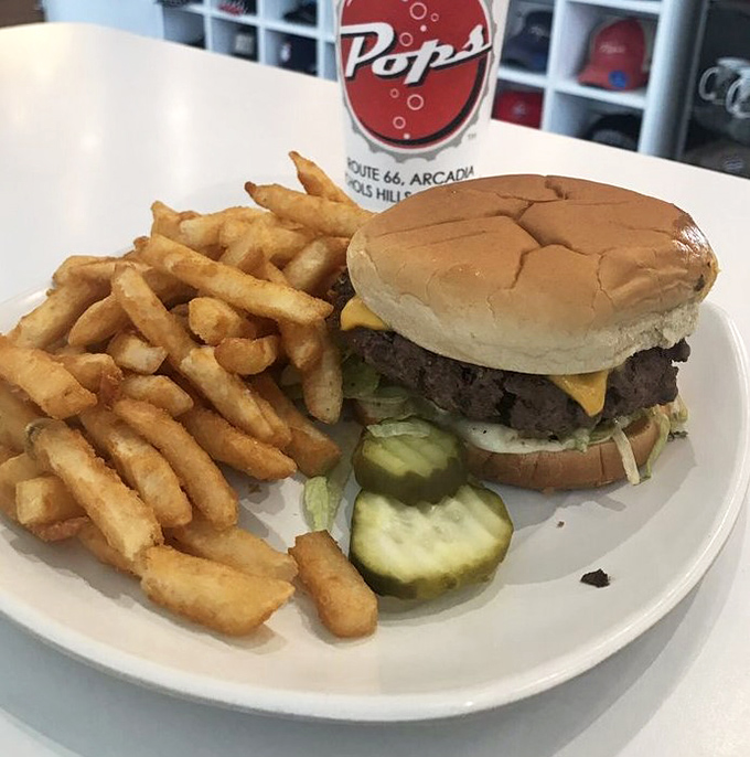 This isn't just a cheeseburger&mdash;it's edible Americana. Golden fries, crisp pickles, and a perfectly proportioned patty that makes drive-thru burgers weep with inadequacy.