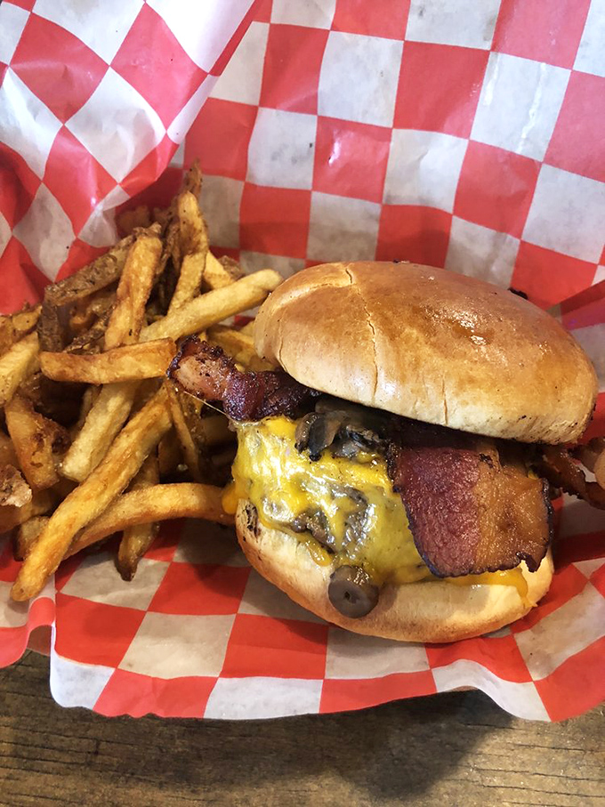 This isn't just a cheeseburger; it's a monument to beef architecture that makes skyscrapers look structurally unsound by comparison.