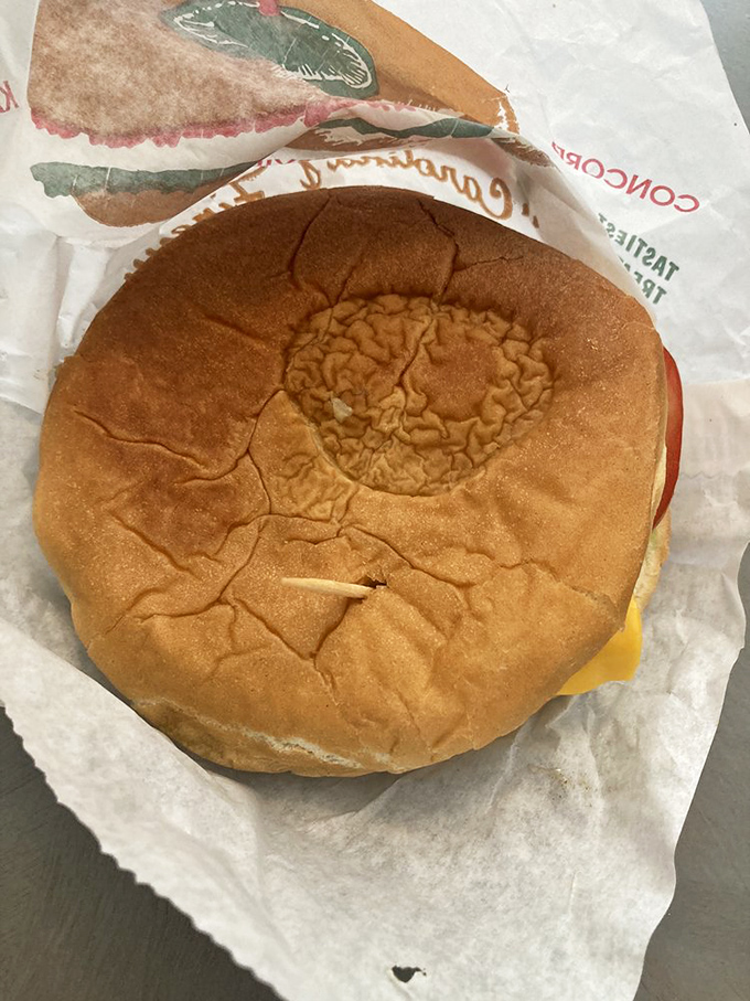 The humble cheeseburger, perfected. That soft bun cradles its contents like a mother holding her firstborn, except you're allowed to eat this one.