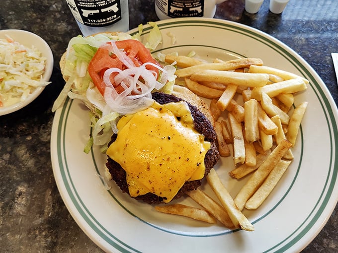 The Railside Double Cheeseburger on a pretzel bun: where Pennsylvania meets perfection on a plate with fries.