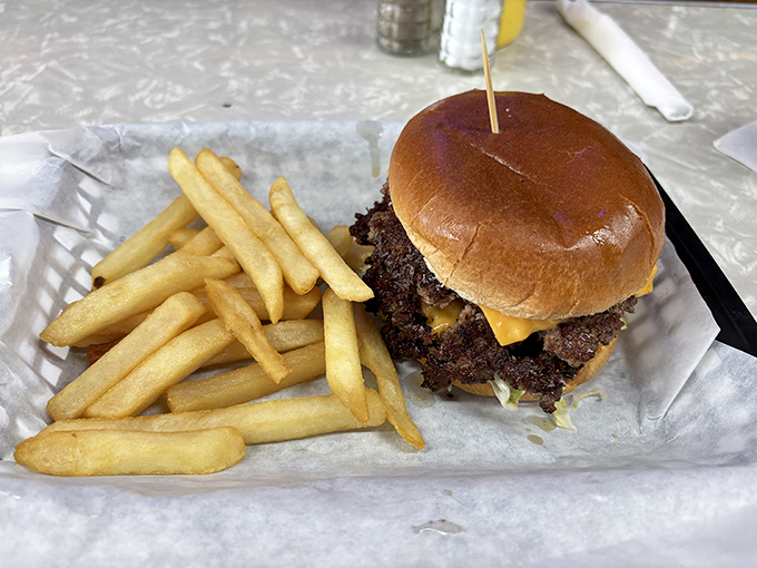 Behold the star of the show &ndash; a perfectly smashed burger with those coveted crispy edges that extend beyond the bun like a meaty solar eclipse.