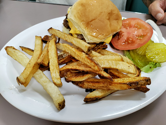 This isn't just a cheeseburger&mdash;it's edible poetry. Those hand-cut fries aren't sides; they're co-stars in this delicious production. 