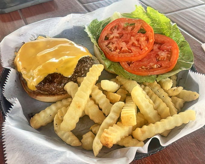 Behold the star of our story! This cheeseburger doesn't need a fancy pedigree to prove its worth&mdash;just one bite tells you why locals keep coming back.
