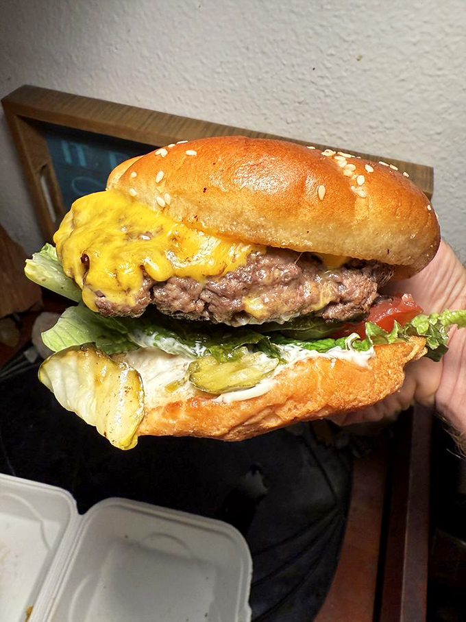 This magnificent beast of a burger makes cardiologists nervous and taste buds sing hallelujah in perfect harmony.