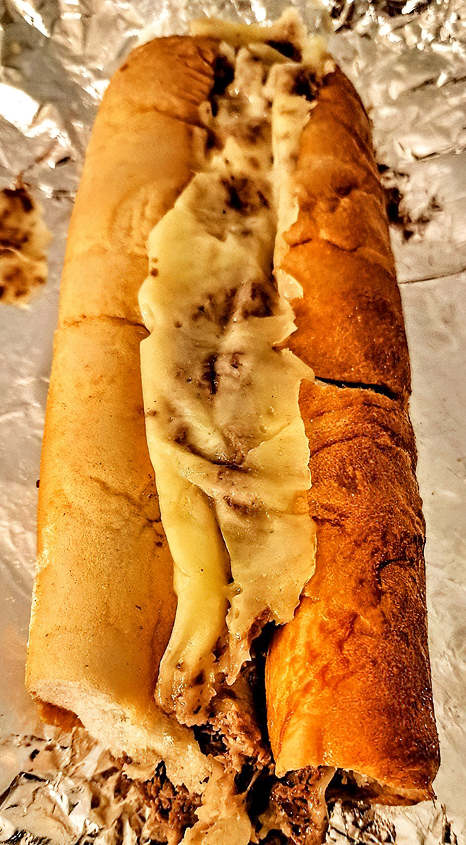 Behold the star attraction: thinly sliced ribeye and molten American cheese embraced by a perfect Italian roll. This isn't just a sandwich; it's Philadelphia's soul made edible.