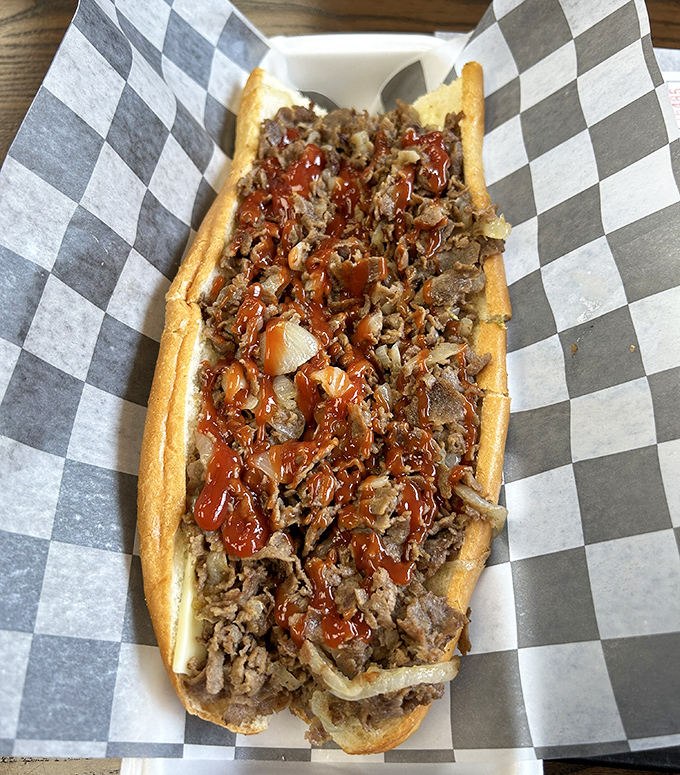 Behold the star attraction: thinly sliced beef piled high on a fresh roll, where ketchup and onions create a harmony that would make the Philadelphia Orchestra jealous.