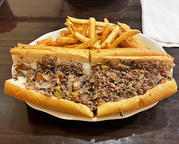 The holy grail of cheesesteaks doesn't whisper, it shouts. Perfectly chopped ribeye, melted cheese, and caramelized onions create a symphony in a roll that demands attention.