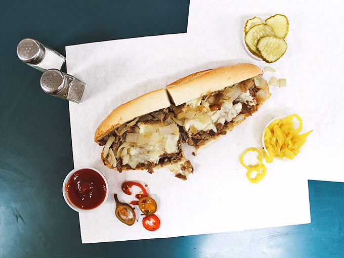 Behold the star of the show—thinly sliced ribeye, perfectly melted cheese, and that roll! This isn't just a sandwich; it's Philadelphia on a plate.