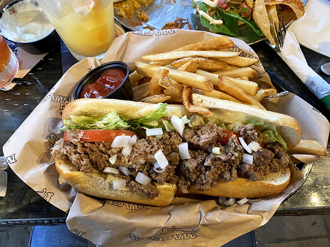 Behold the star of the show—a cheesesteak that makes crossing state lines to Philadelphia seem utterly unnecessary. Those caramelized onions aren't just toppings; they're supporting characters.