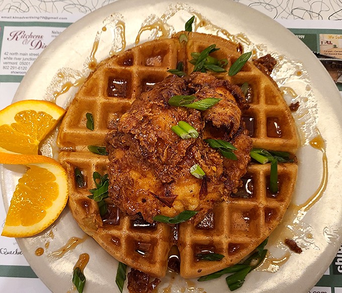 Behold the star attraction: chicken and waffles that would make your Southern grandmother weep with pride. That golden waffle isn't just a platform&mdash;it's a throne.
