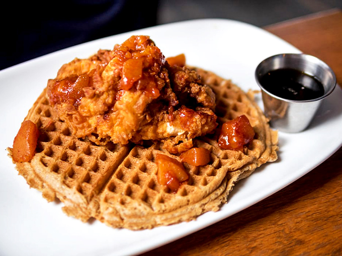 Golden-fried chicken perched atop a Belgian waffle, crowned with whiskey-peach compote &ndash; a breakfast so good it should require ID.