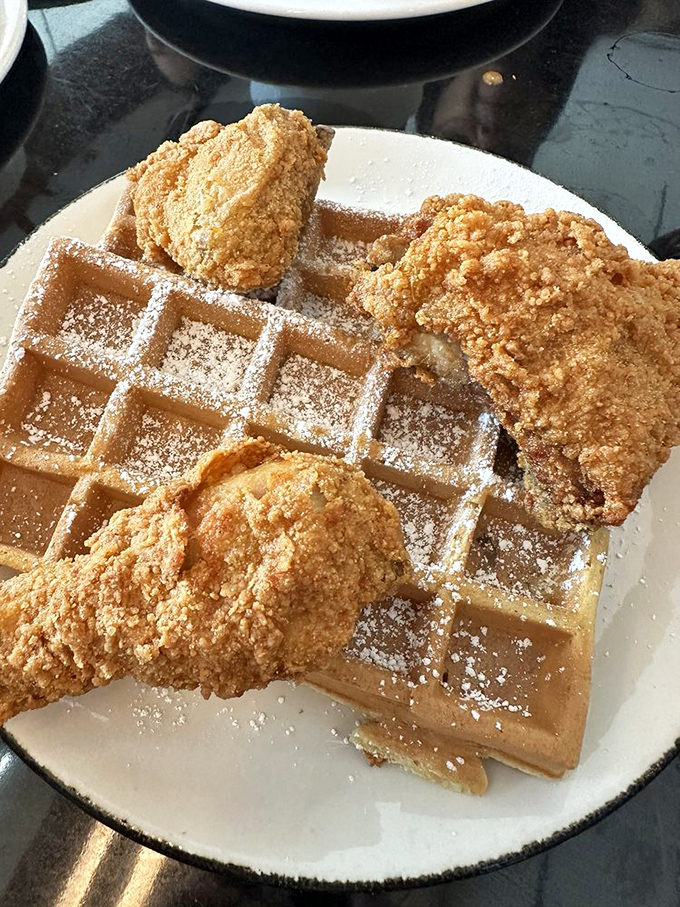 Behold the star attraction: golden-brown Belgian waffles crowned with impossibly crispy chicken&mdash;a sweet and savory duet that makes breakfast and dinner jealous they weren't invited.