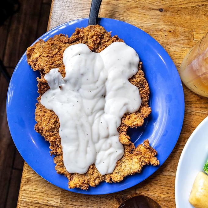 The legendary chicken fried steak in all its glory. That golden crust and pepper-speckled gravy could make a vegetarian question their life choices.